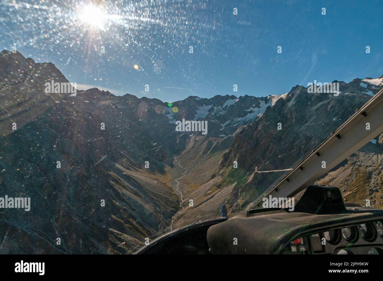 High view from a helicopter cockpit over the Mount Cook range towards ...