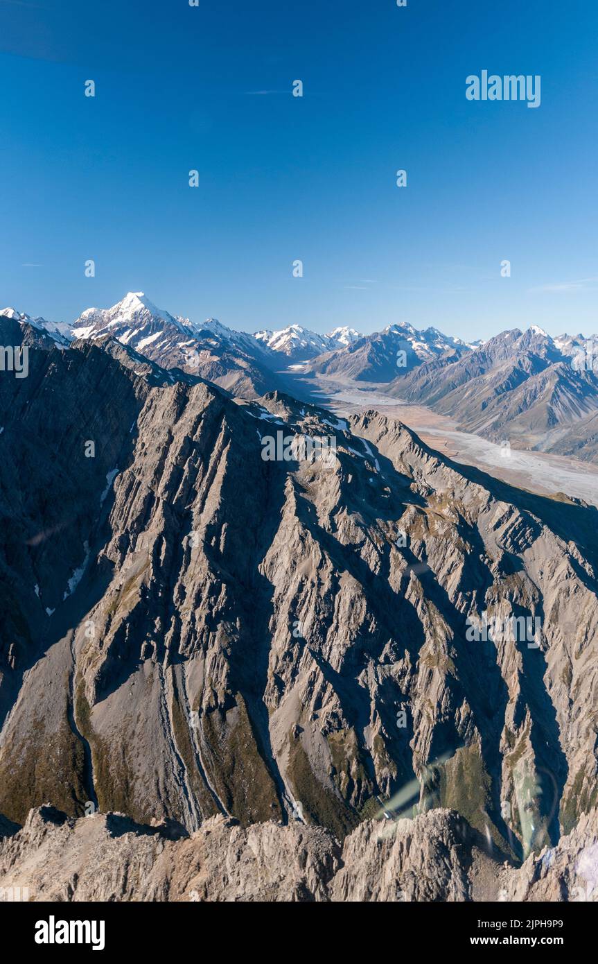High view from the summit of the Mount Cook range towards the snow ...