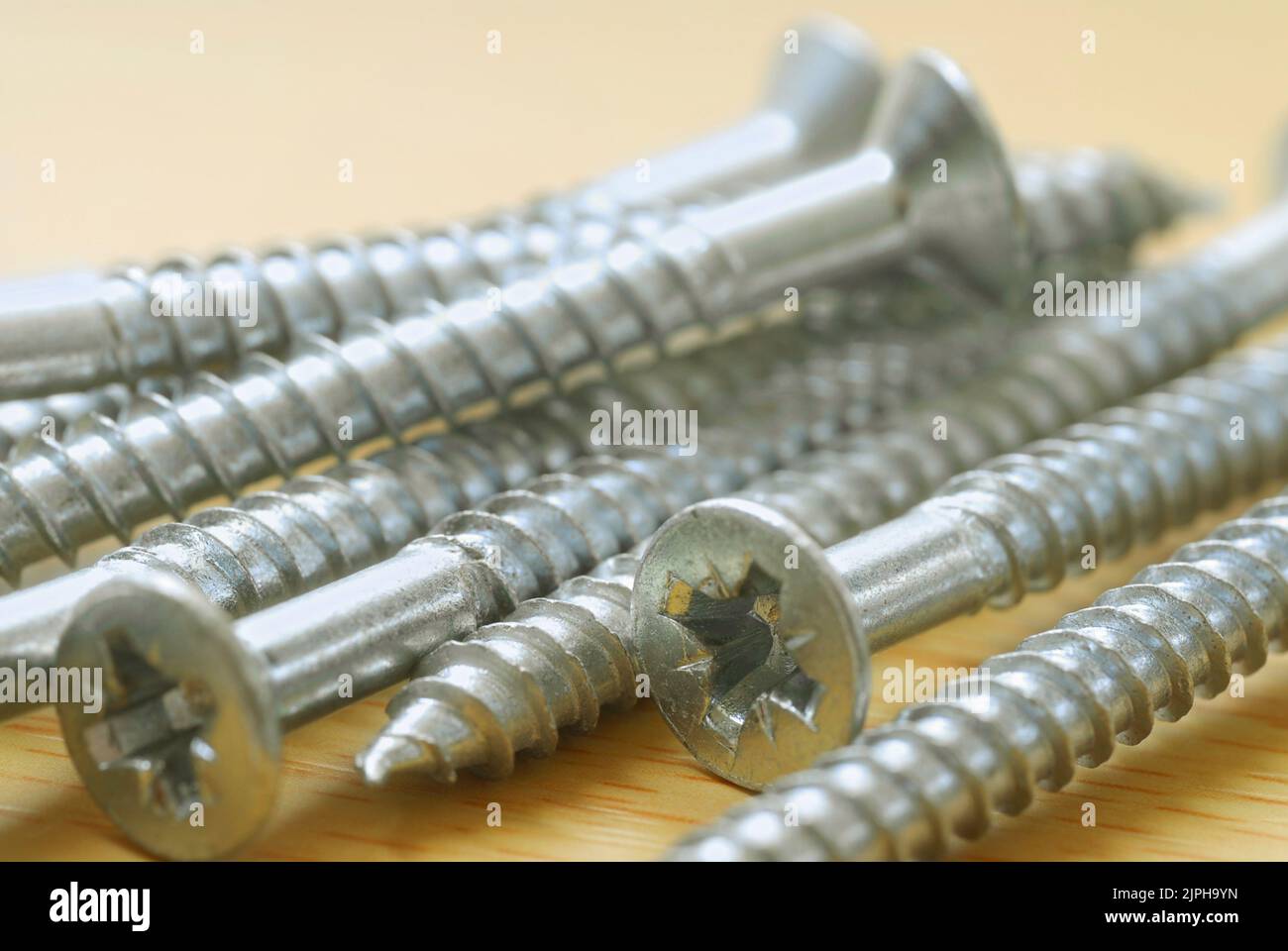 A pile of long metal screws close up Stock Photo - Alamy