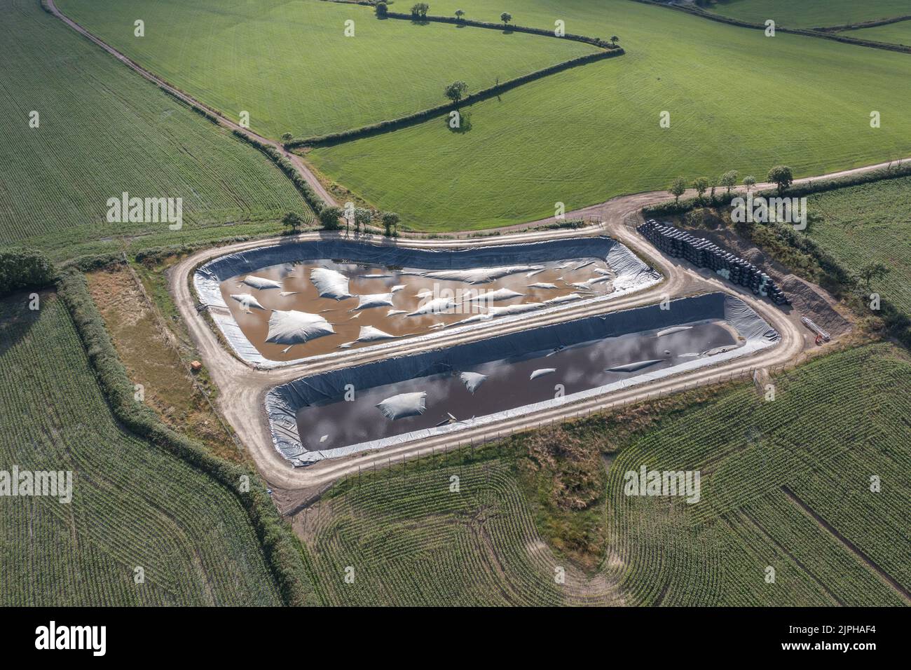 Aerial view of large slurry lagoons with membrane covers to prevent ...