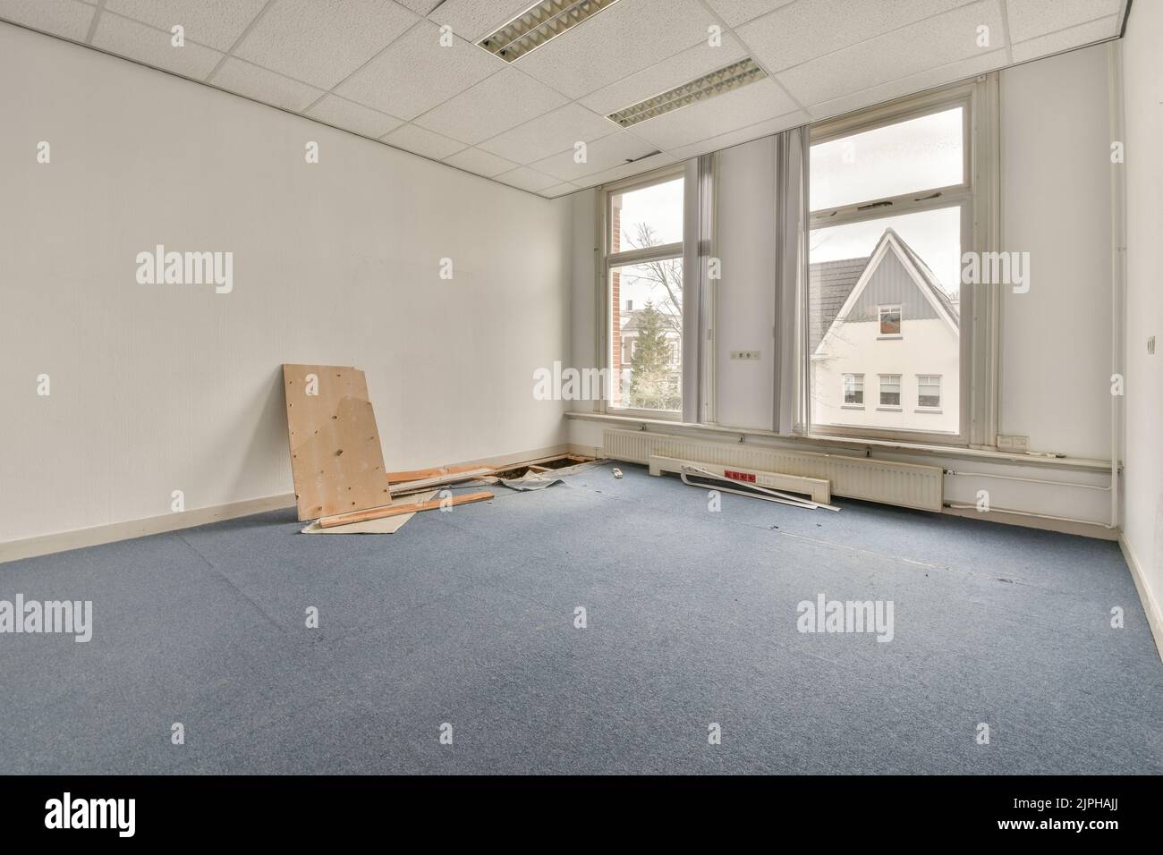 Interior of empty white room with large balcony windows with curtains ...