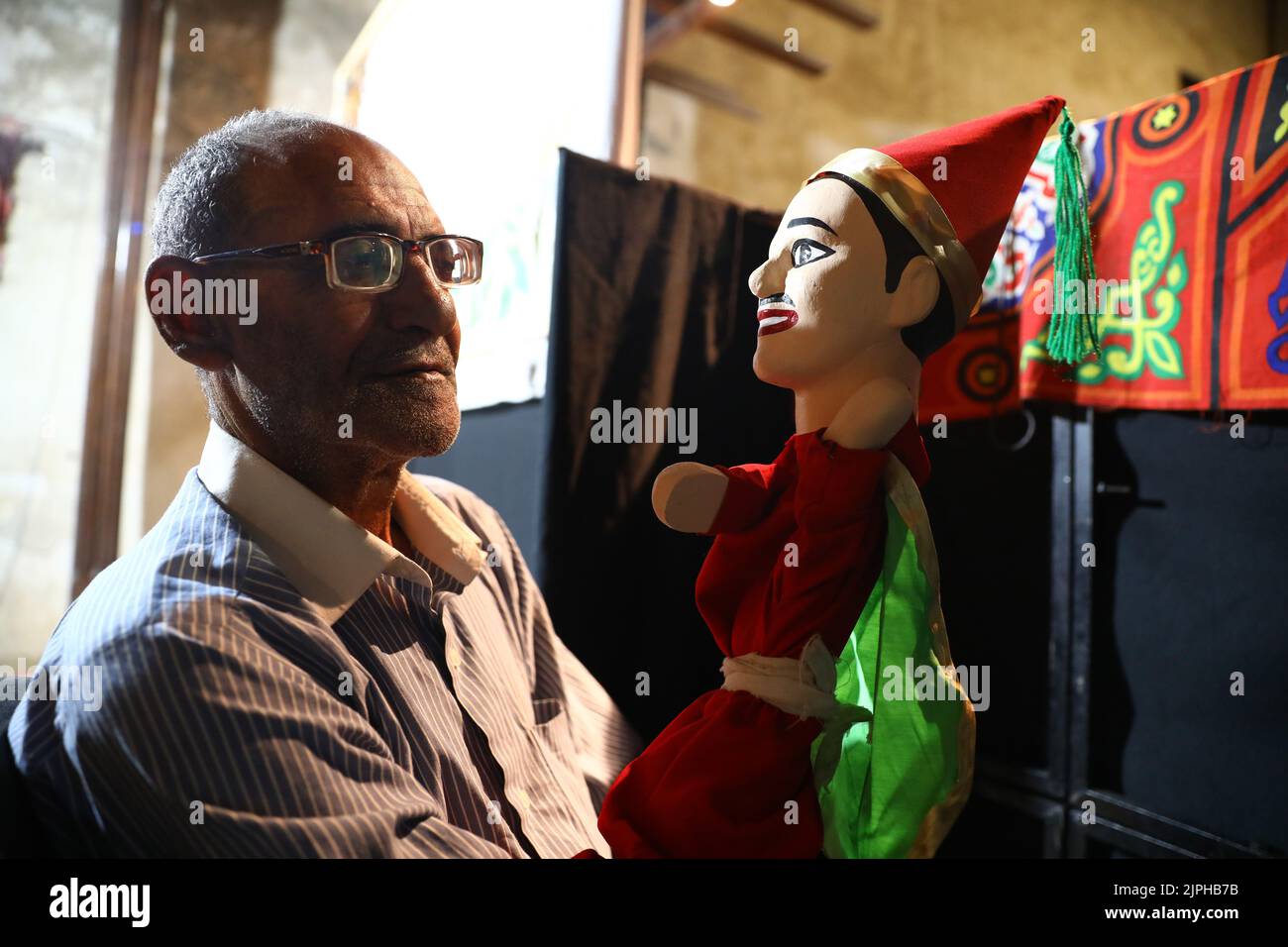 Cairo, Egypt. 16th Aug, 2022. An artist shows a puppet after an Aragoz ...