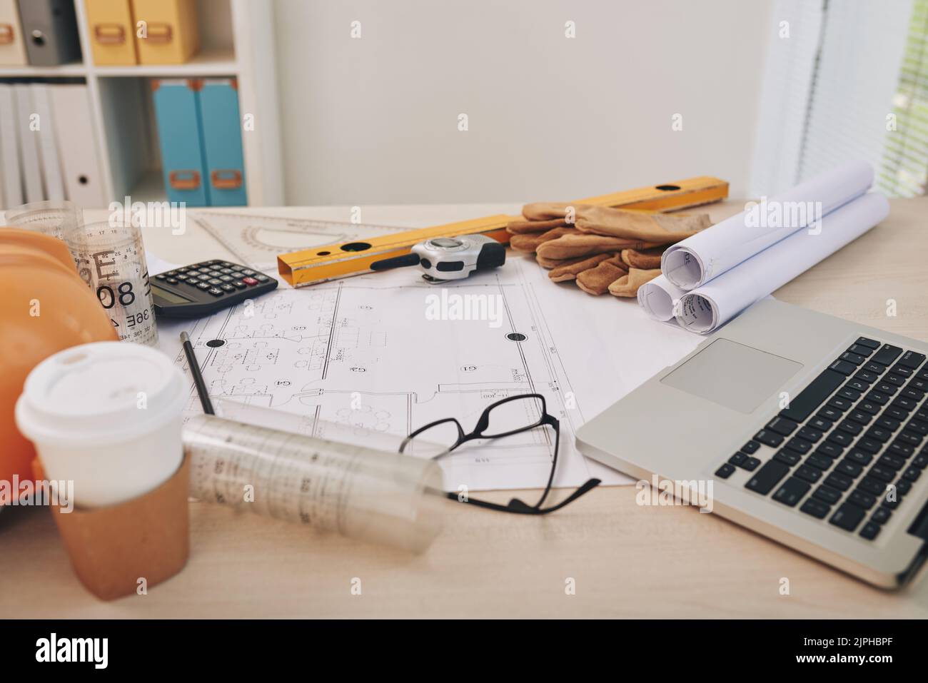 Blueprint of project, laptop and belongings of architect Stock Photo ...