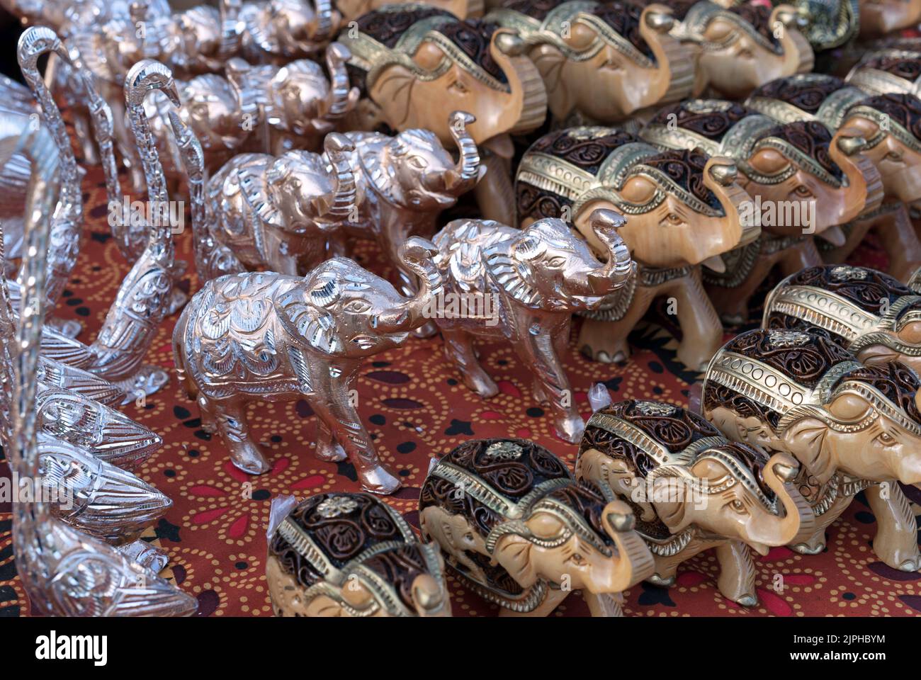 Metal and wooden figurines of Indian elephants with national ornaments ...