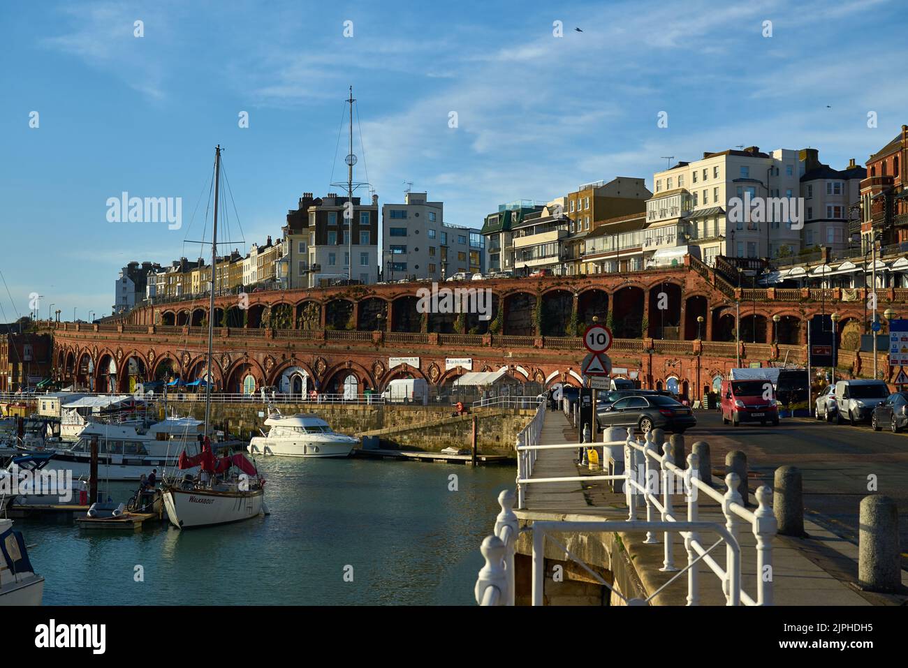 The Arches of Ramsgate Royal Harbour with lots of ships and boats on a ...