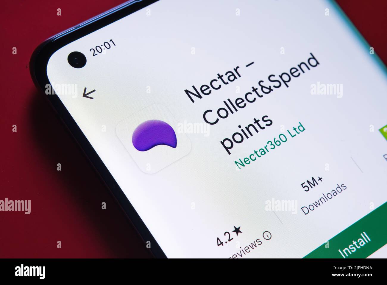 Nectar app seen in Google Play Store on the smartphone screen placed on ...