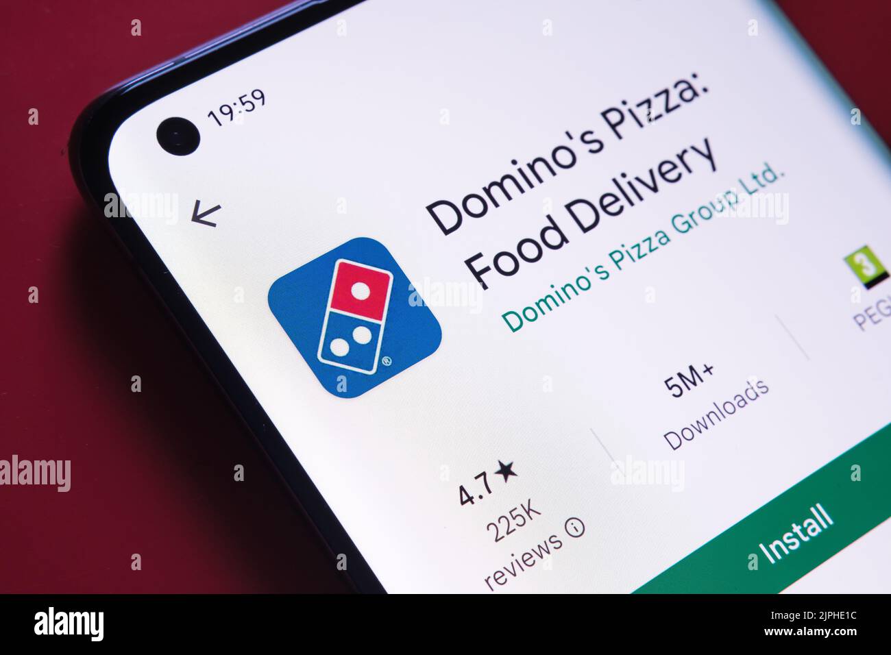 dominos Pizza app seen in Google Play Store on the smartphone screen ...