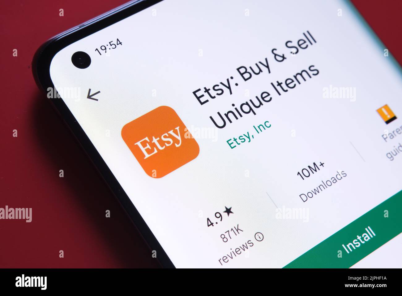 Etsy app seen in Google Play Store on the smartphone screen placed on ...