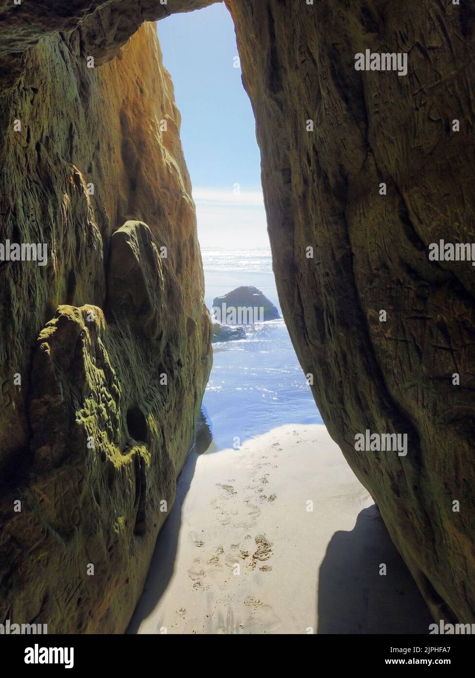 The interior of a cave rock with the sea outside Stock Photo - Alamy