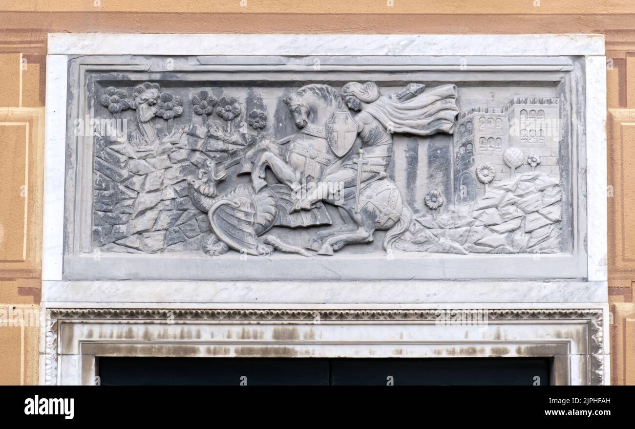 a stone capital over the door depicting the Catholic myth of St. George ...