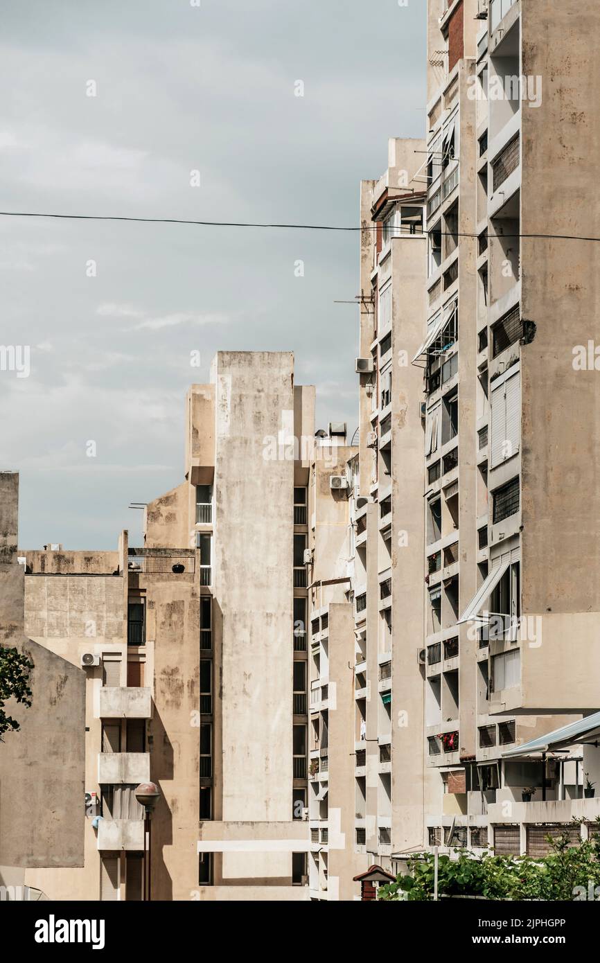 A vertical shot of a residential area with brutalist concrete ...