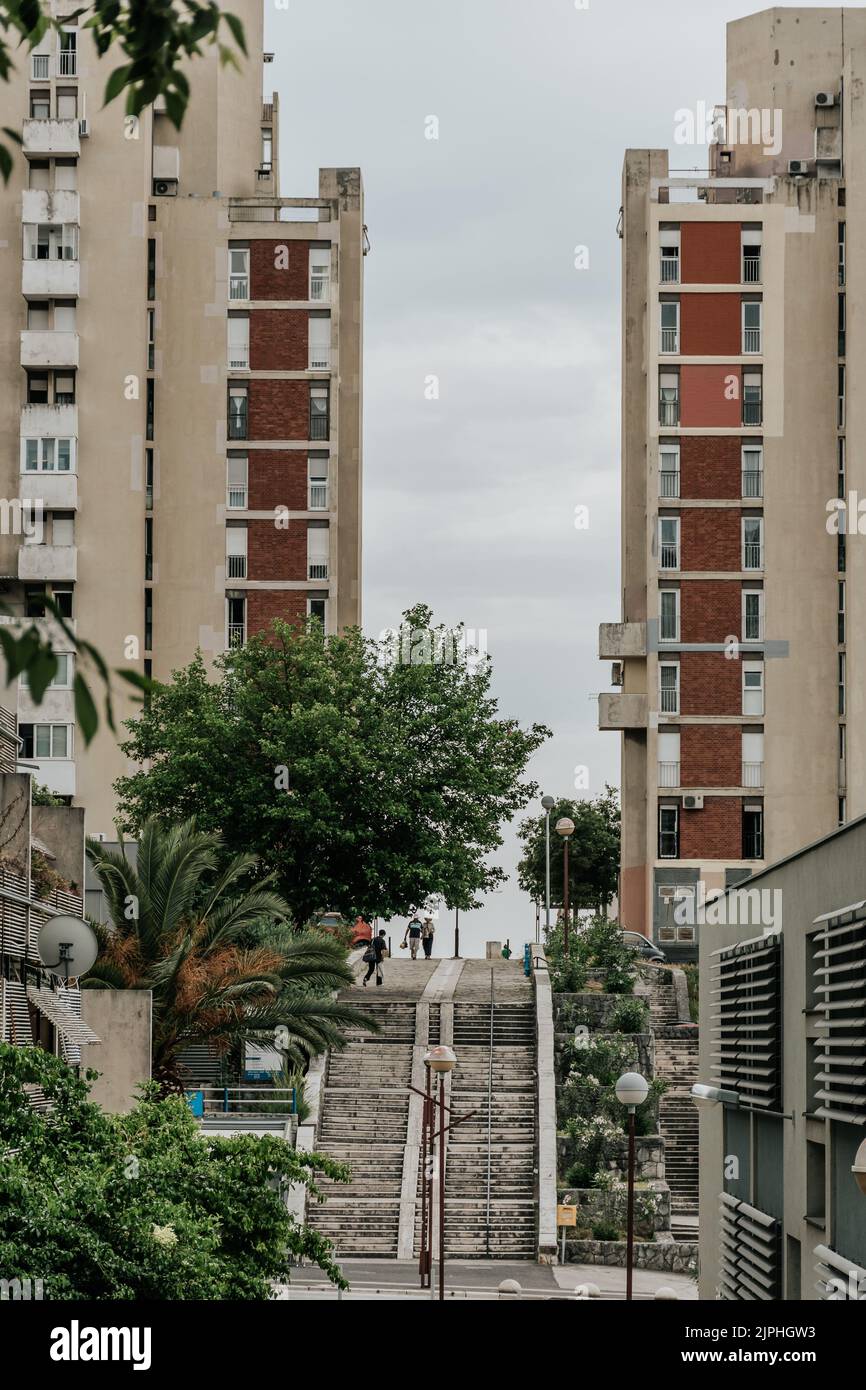 A vertical shot of a residential area with brutalist concrete ...