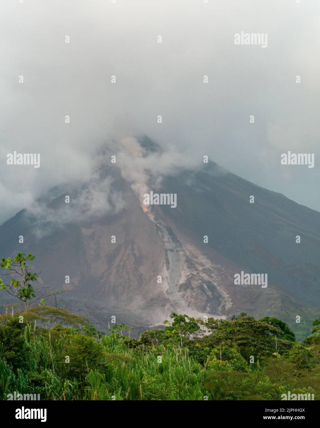 A mesmerizing vertical view of lava and dust spewing from an active ...