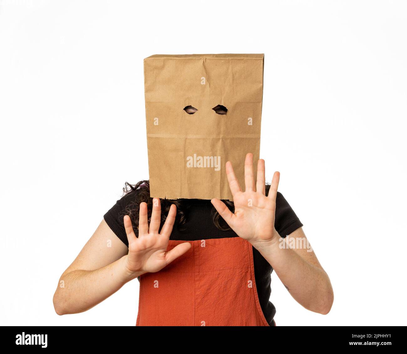 Woman wearing paper bag over her head to defend herself Stock Photo - Alamy