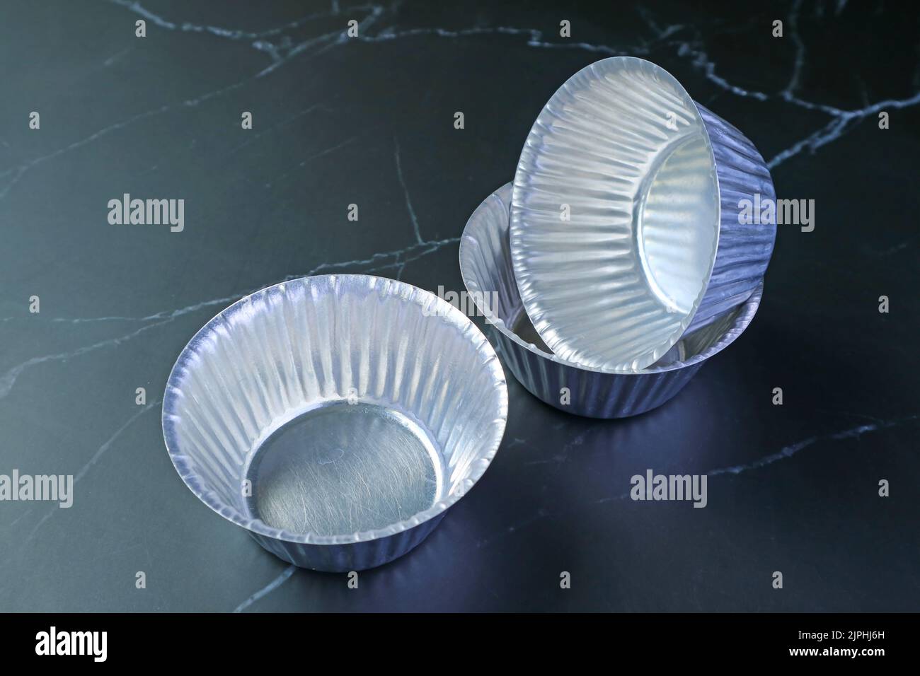 Heap of Empty Aluminum Muffin Cupcake Molds Isolated on Kitchen's Table ...