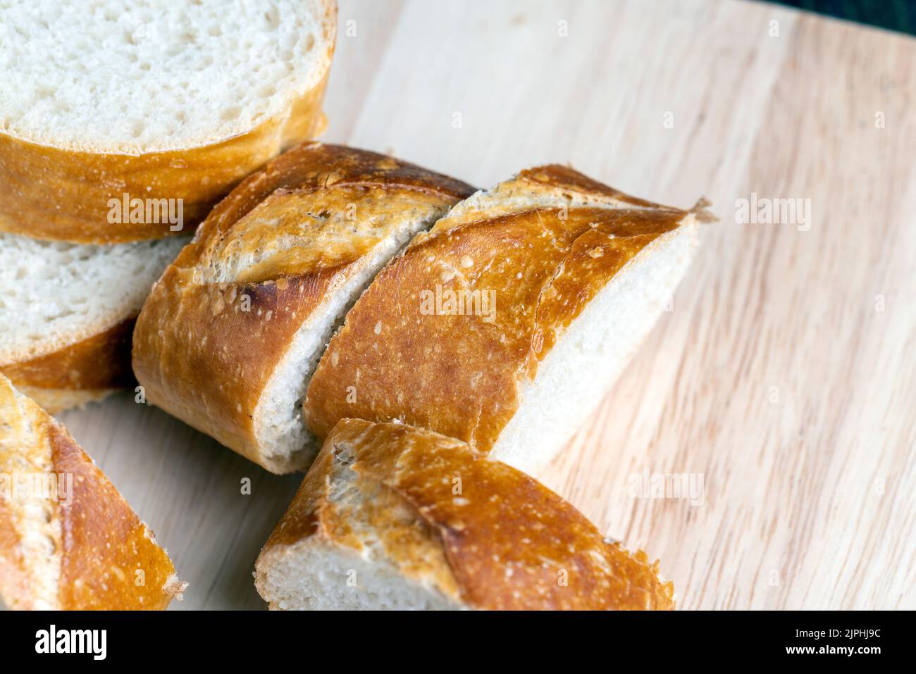 sliced into pieces a long baguette with a crispy crust, cut into slices ...