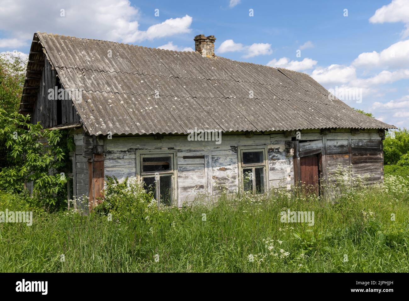 An old abandoned wooden house, an old one-story damaged wooden house in ...