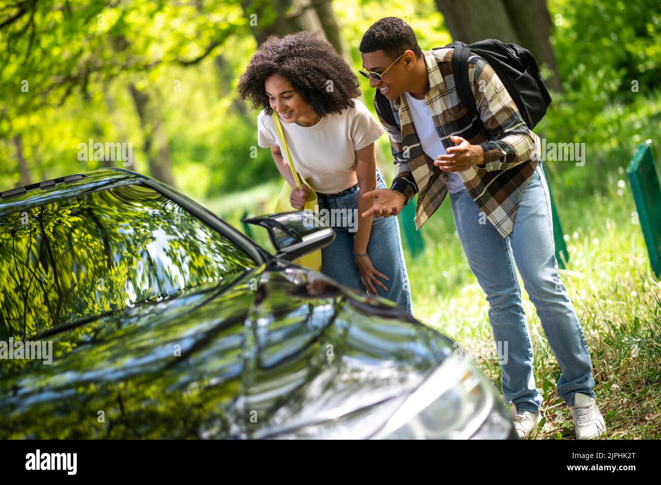 Two young people on te road asking the way to the city Stock Photo - Alamy