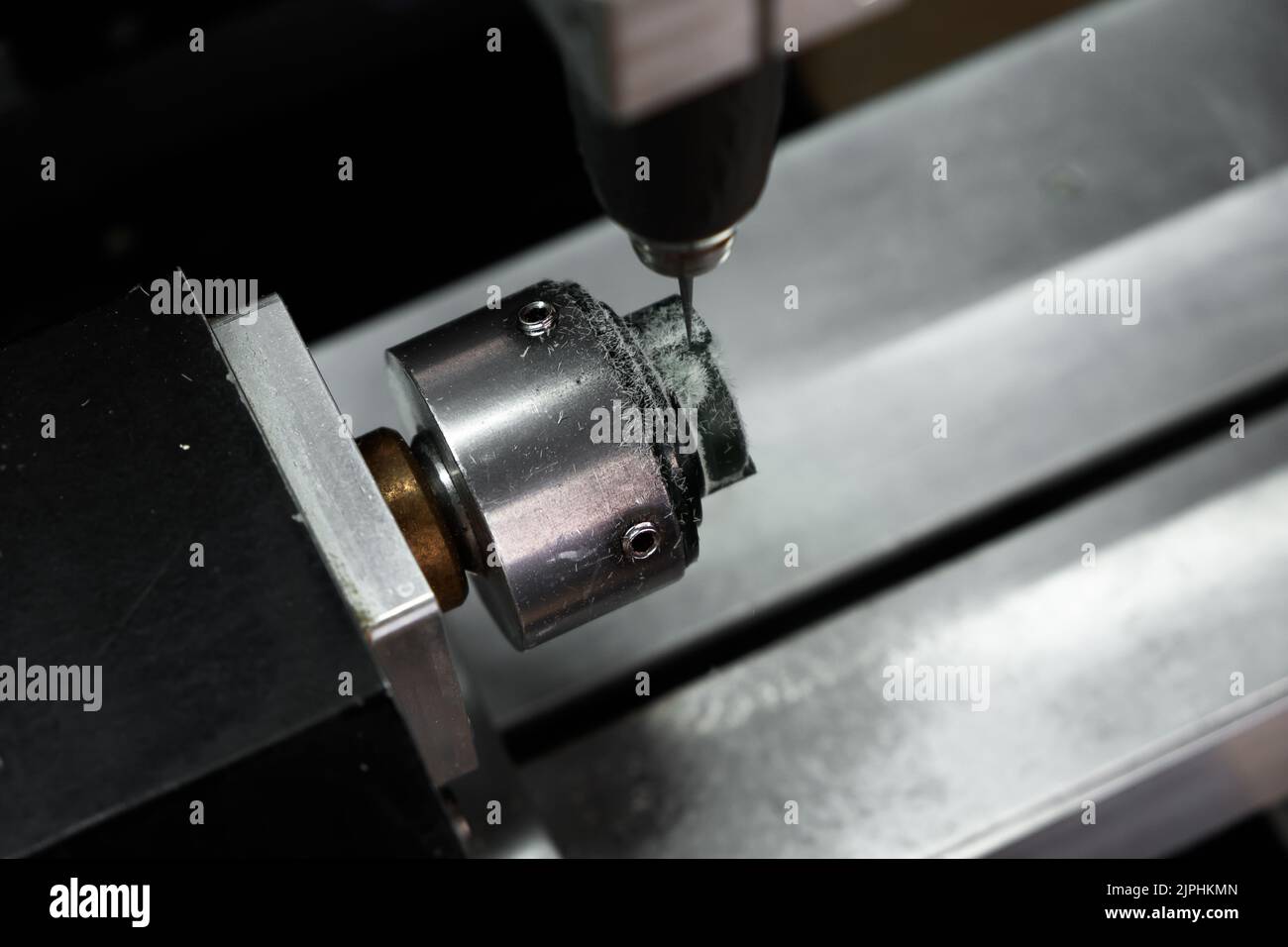 Modern jewelry technology. Cnc machine cuts out green wax ring ...