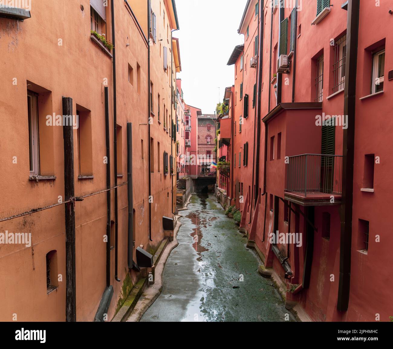 A wet pathway surrounded by buildings in Bologna, Italy Stock Photo - Alamy