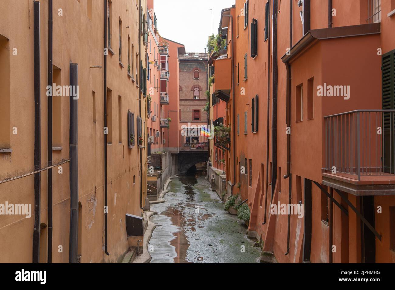 A wet pathway surrounded by buildings in Bologna, Italy Stock Photo - Alamy