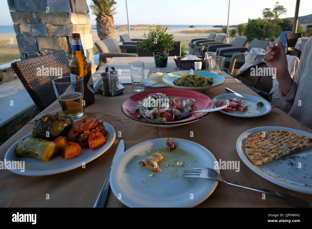 Delicious Greek food at a restaurant in front of the Manganari beach in ...