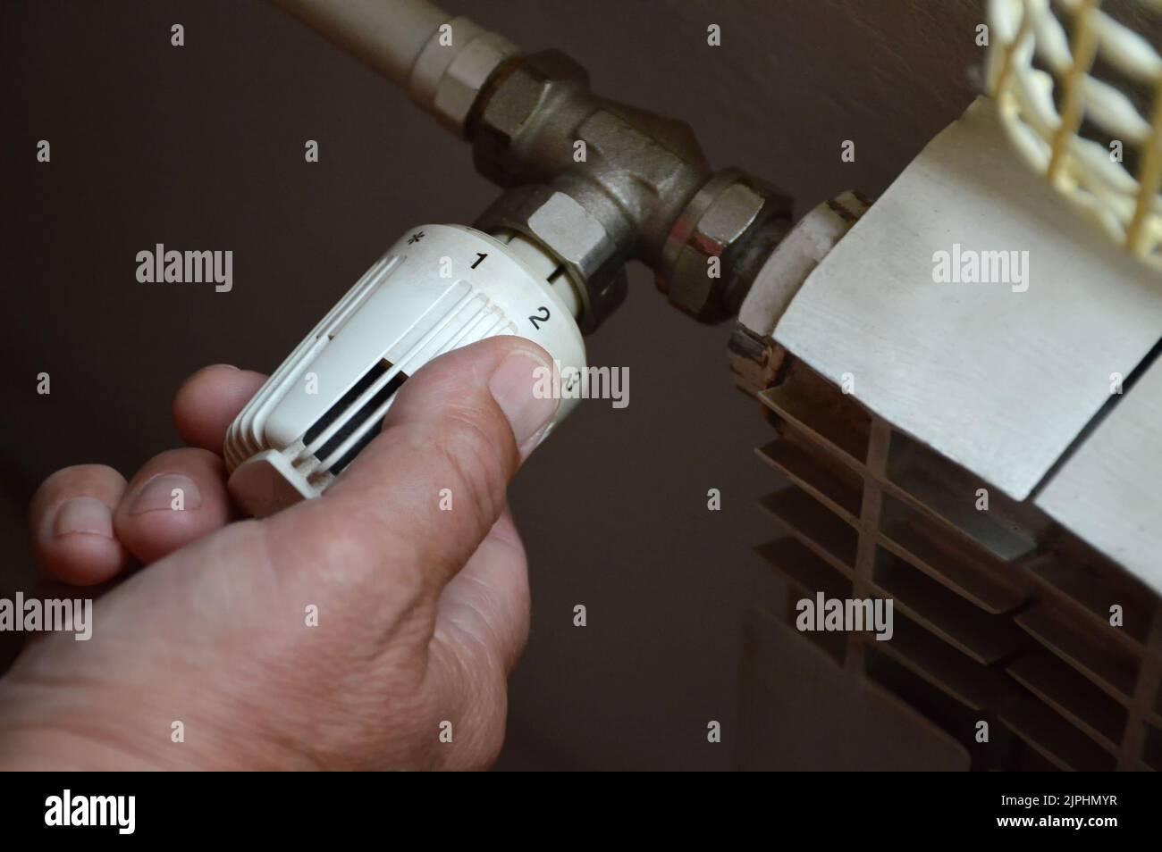 Adjusting thermostatic radiator valve to control central heating ...