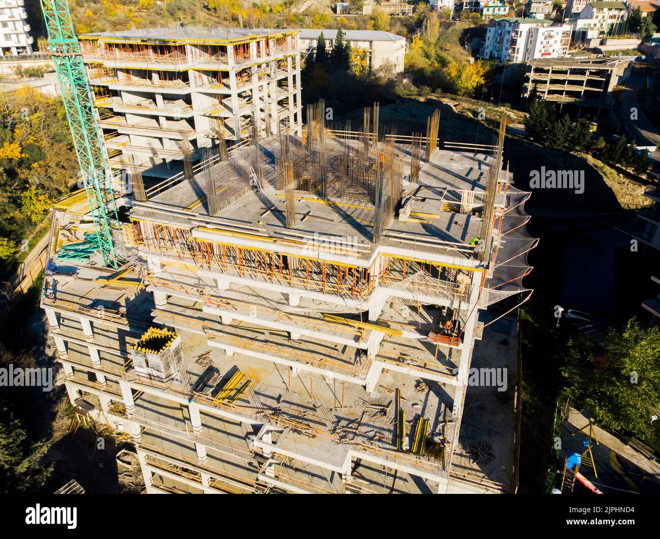 Aerial view construction site with crane cary block material and ...