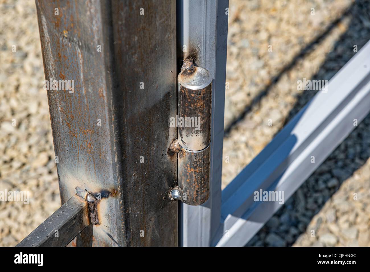 Metal hinge on the gate Stock Photo - Alamy