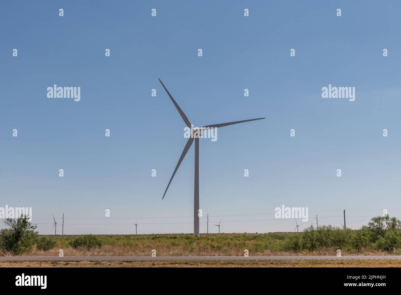 Modern west Texas vista in the summer with wind turbines in the desert ...
