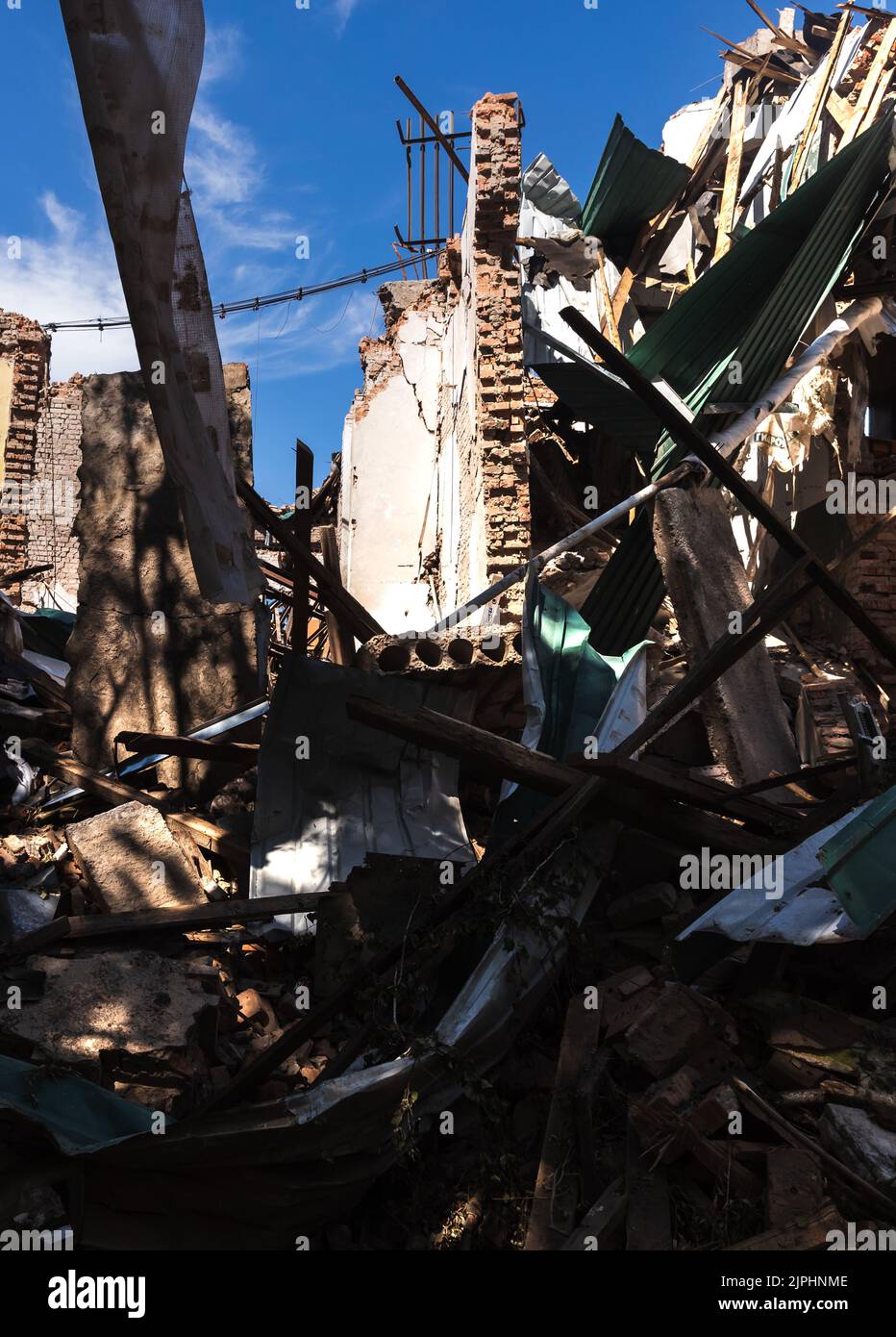 Brick ruined wall of destroyed cultural center amid Russia's invasion ...