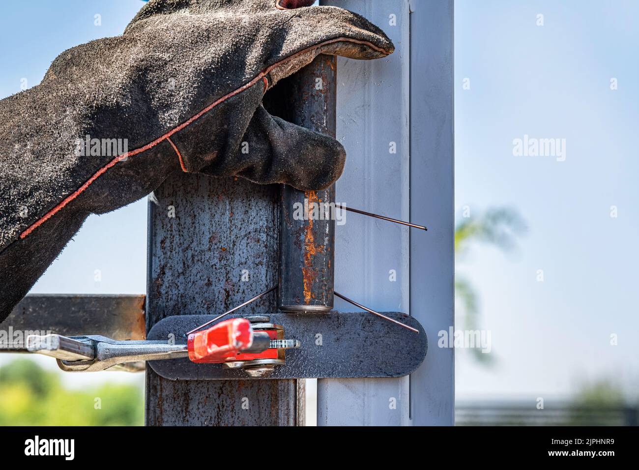 A worker installs a metal profile Stock Photo - Alamy