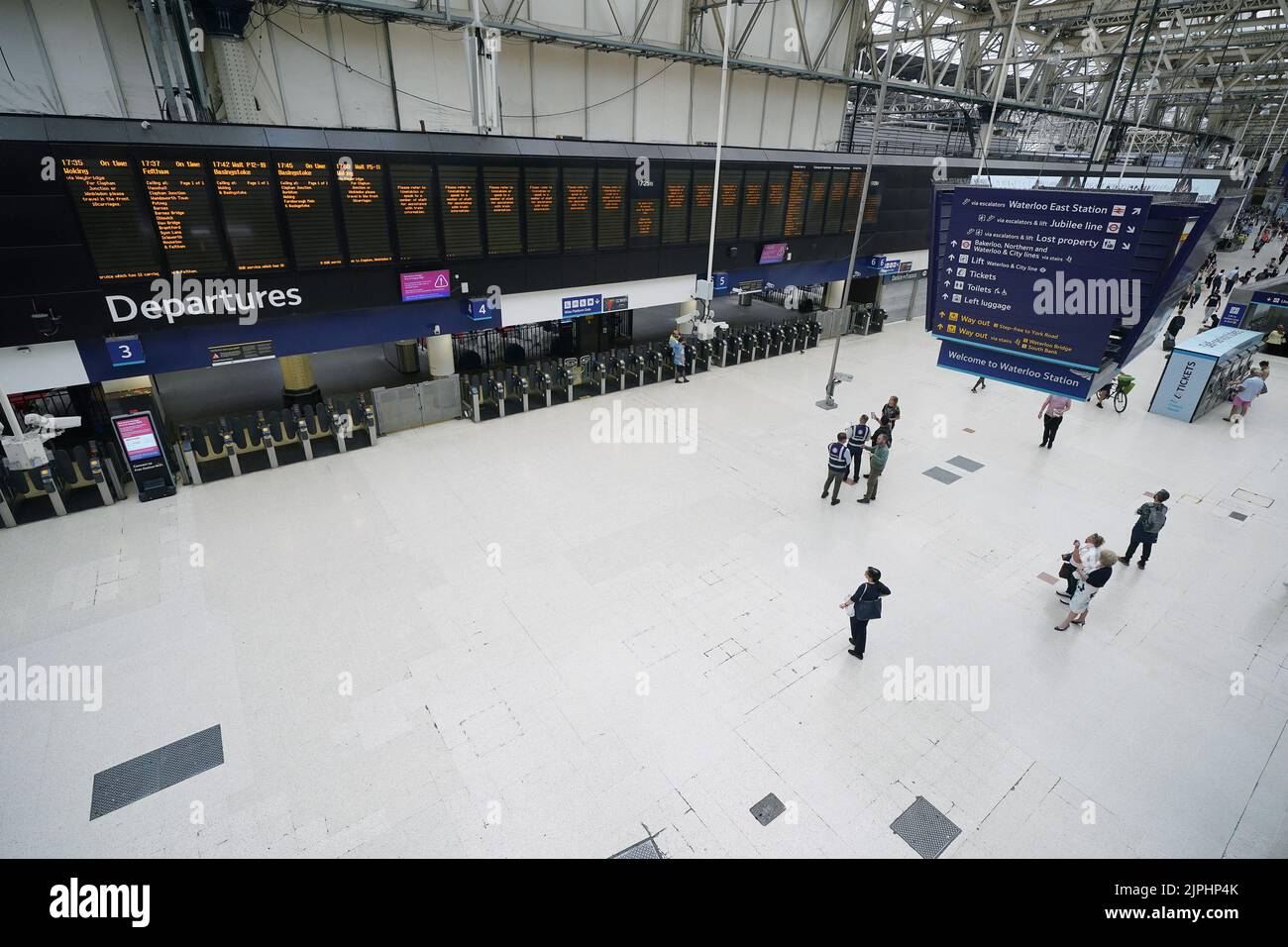 Commuters during the evening rush hour at Waterloo Station in London ...