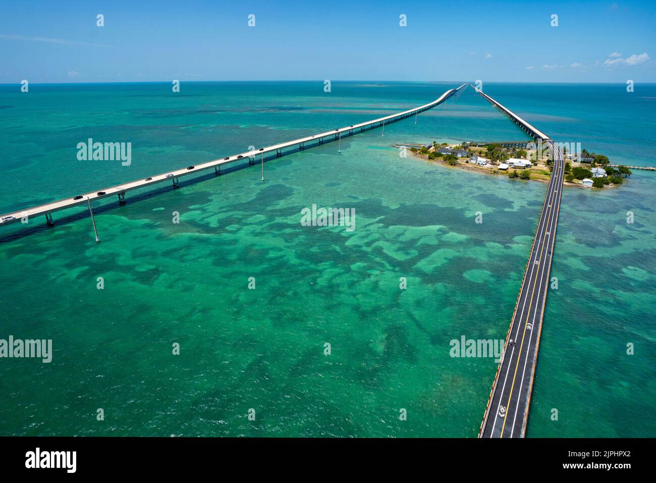 The newly-renovated Old Seven Mile Bridge at right leads cyclists and ...