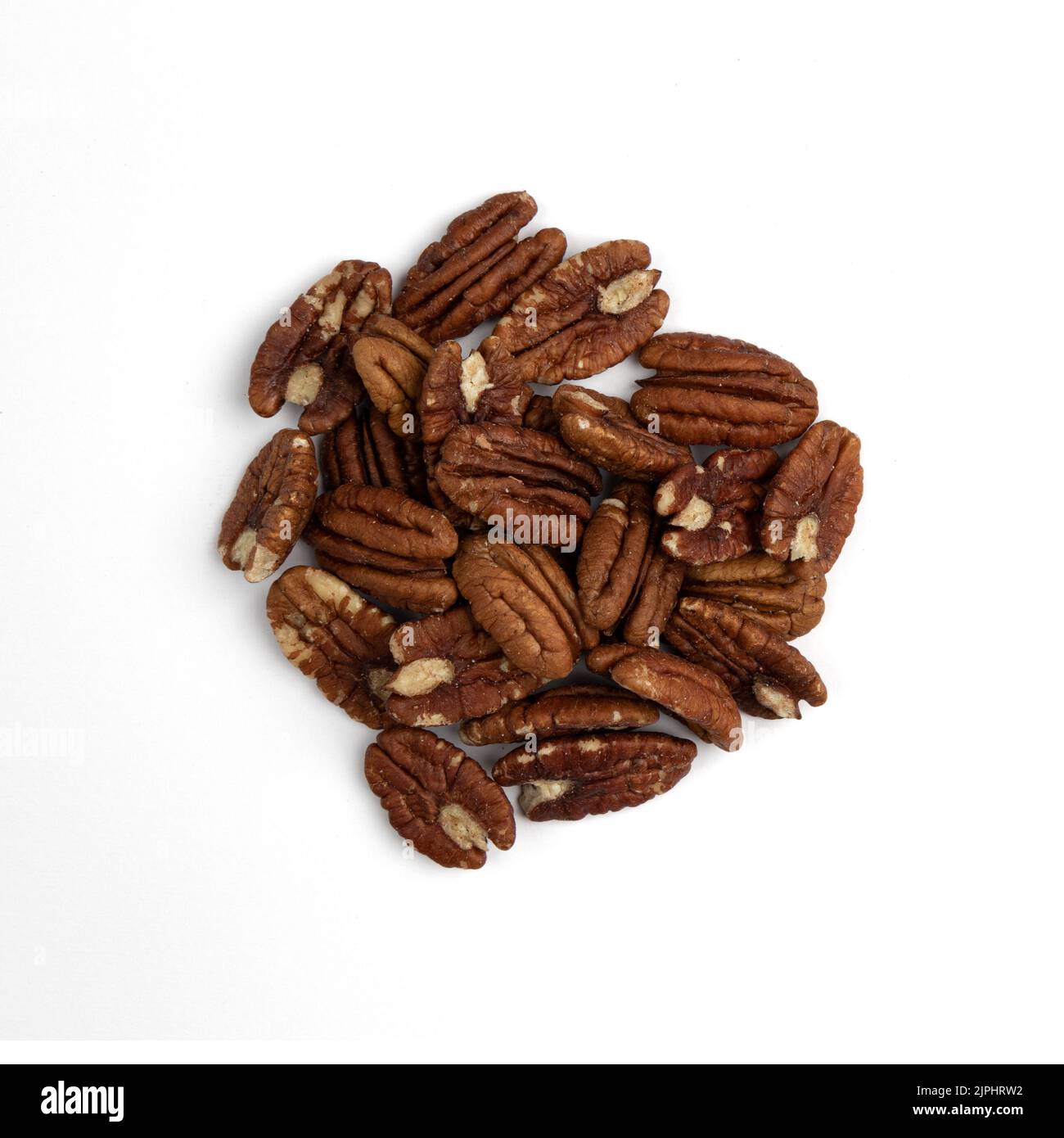 heap of peeled pecan nuts isolated on white background, top view ...