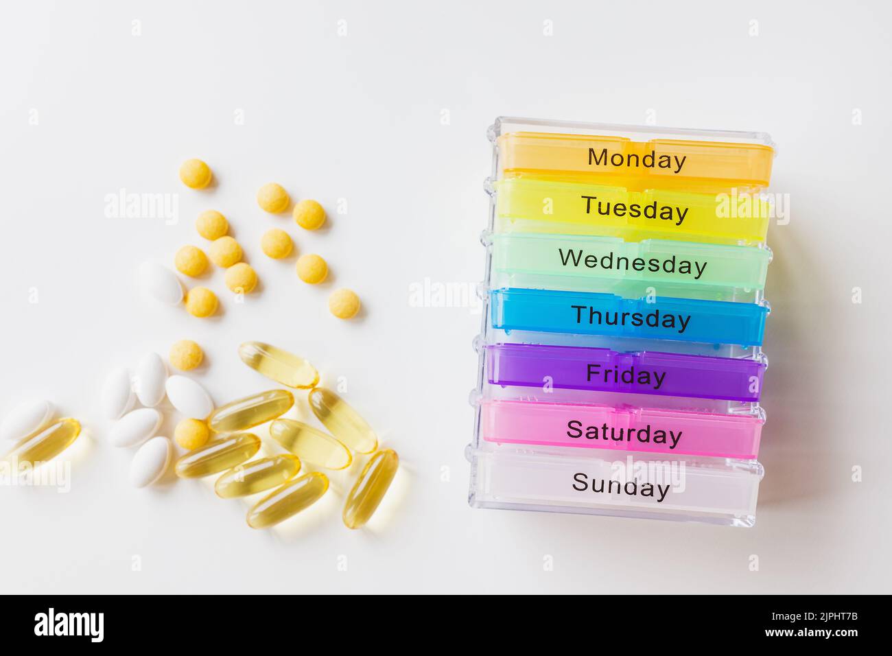 Week medicine dispenser. Plastic seven day weekly container with ...