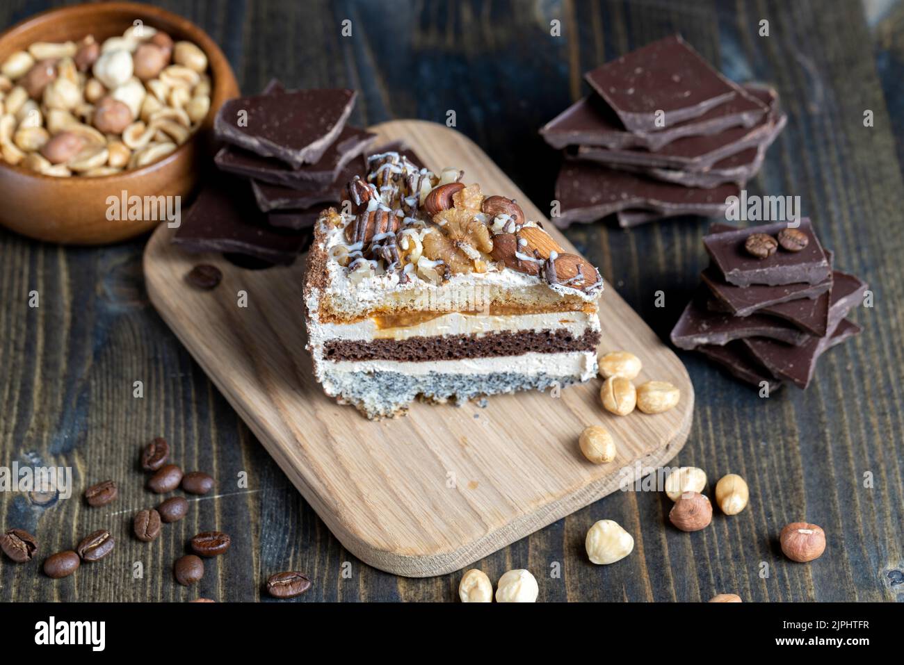 multi-layer cake with different layers, caramel, poppy seeds and cream ...