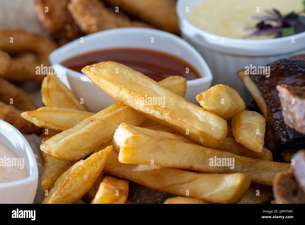 a set of different types of products fried together, French fries ...