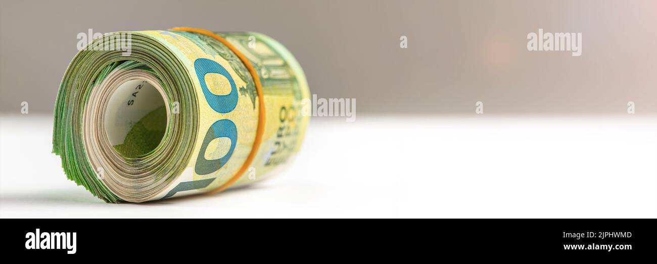 Roll of money. Roll of 100 euro banknotes. Euro banknotes rolled up on ...