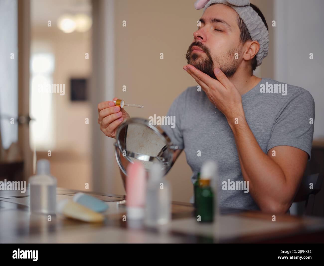 Men's beauty concept. caucAsian guy checking his skin. Skin nutrition ...