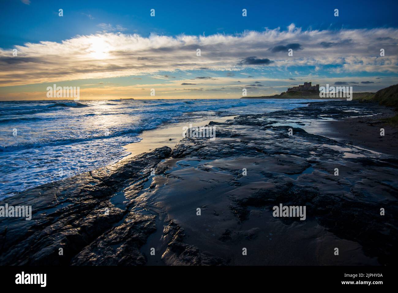 Bamburgh Castle on the coastline of Northumberland. Once the residence ...