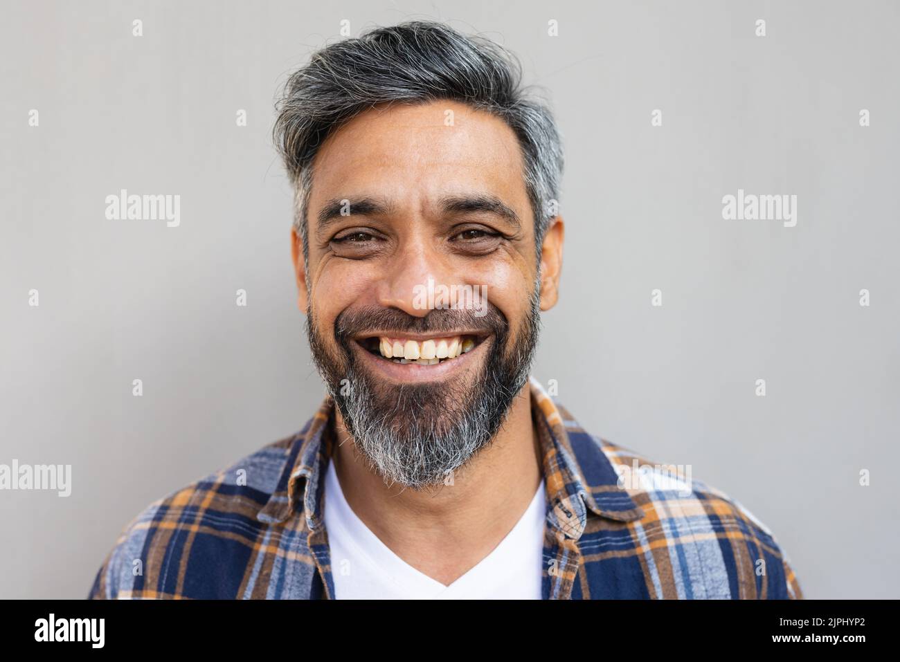 Portrait of happy biracial man wearing shirt and smiling Stock Photo - Alamy