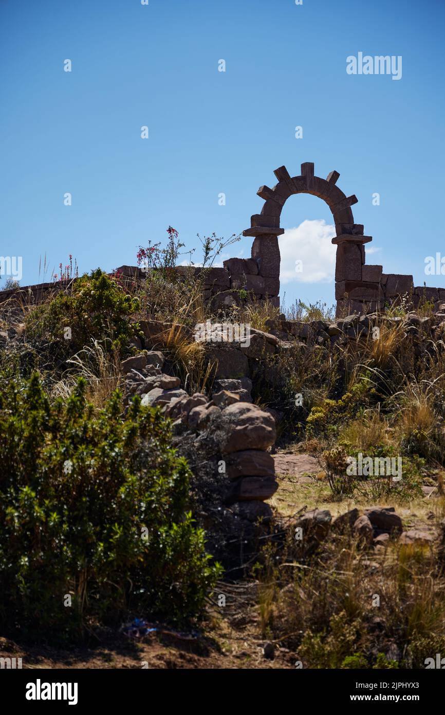 An arch on the coastal hills of the lake Titicaca, Peru Stock Photo - Alamy