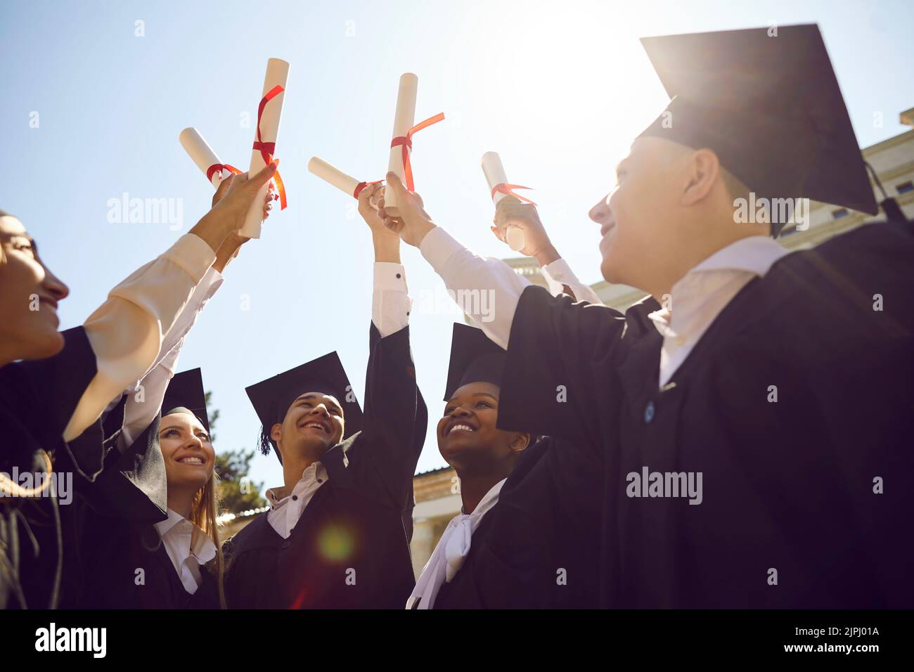 Happy diverse college or university students are having fun on their ...