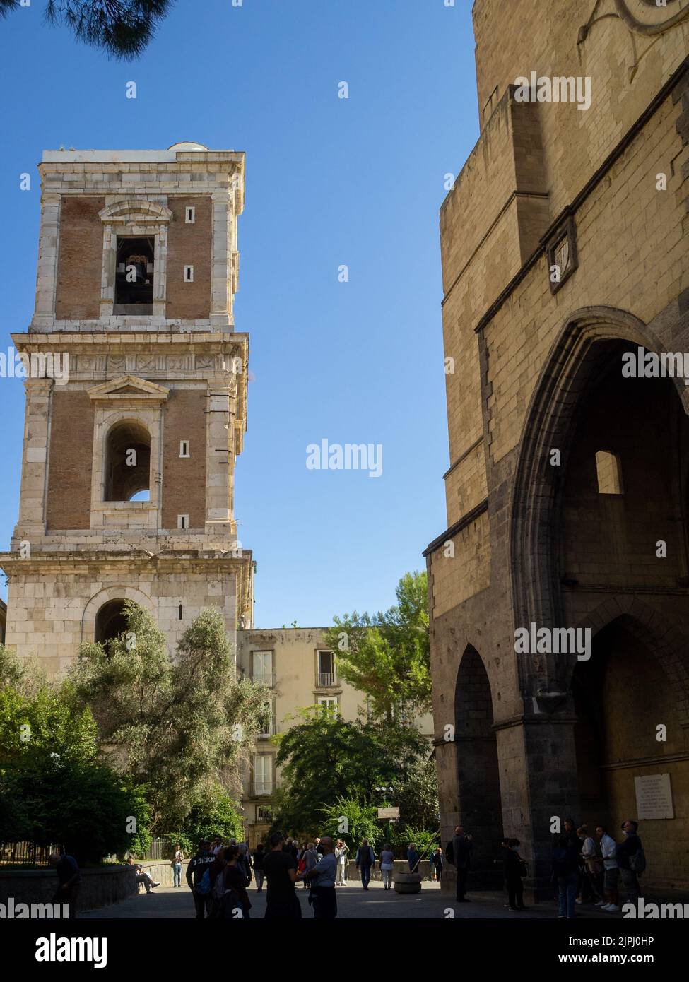 Bell tower and doorway of the Complesso Monumentale di Santa Chiara ...