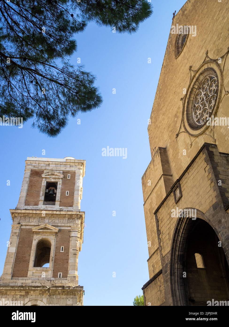 Bell tower and doorway of the Complesso Monumentale di Santa Chiara ...