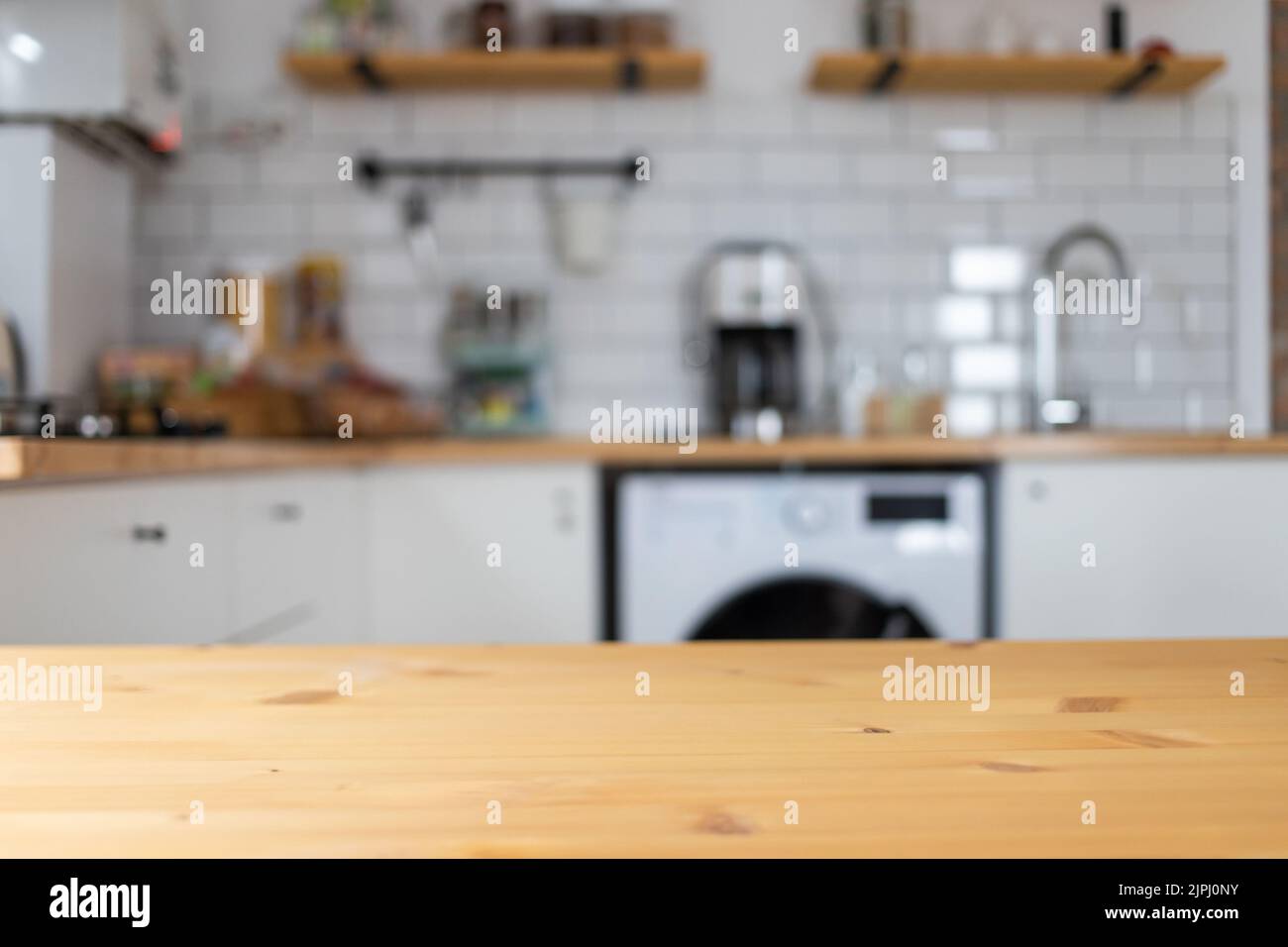 empty wooden tabletop and blurred kitchen mock up for product display ...