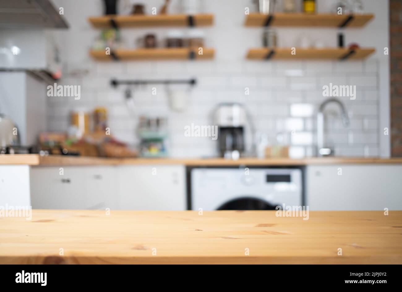 empty wooden tabletop and blurred kitchen mock up for product display ...