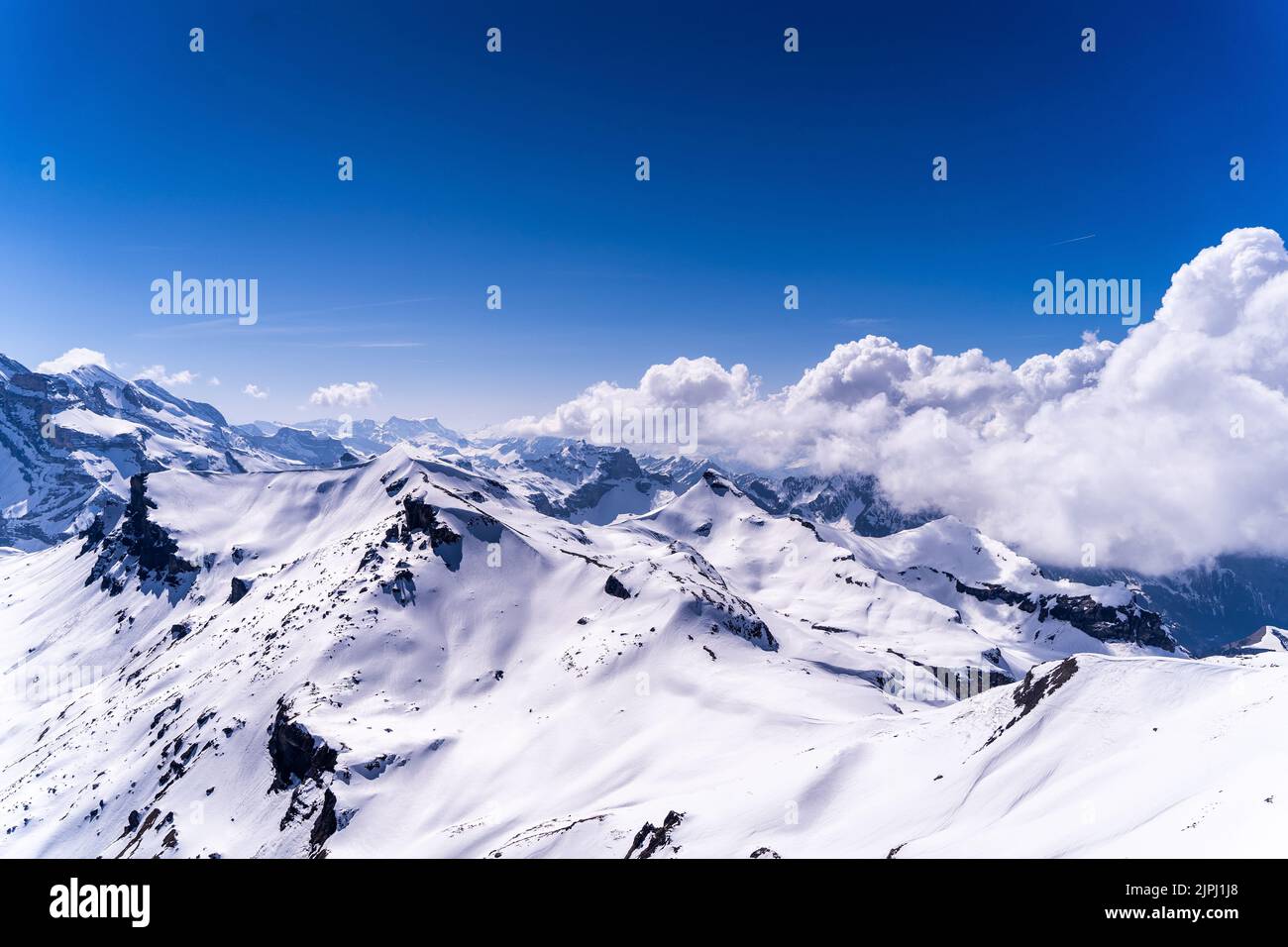An aerial view of the snowy Schilthorn mountains in the Jungfrau Region ...