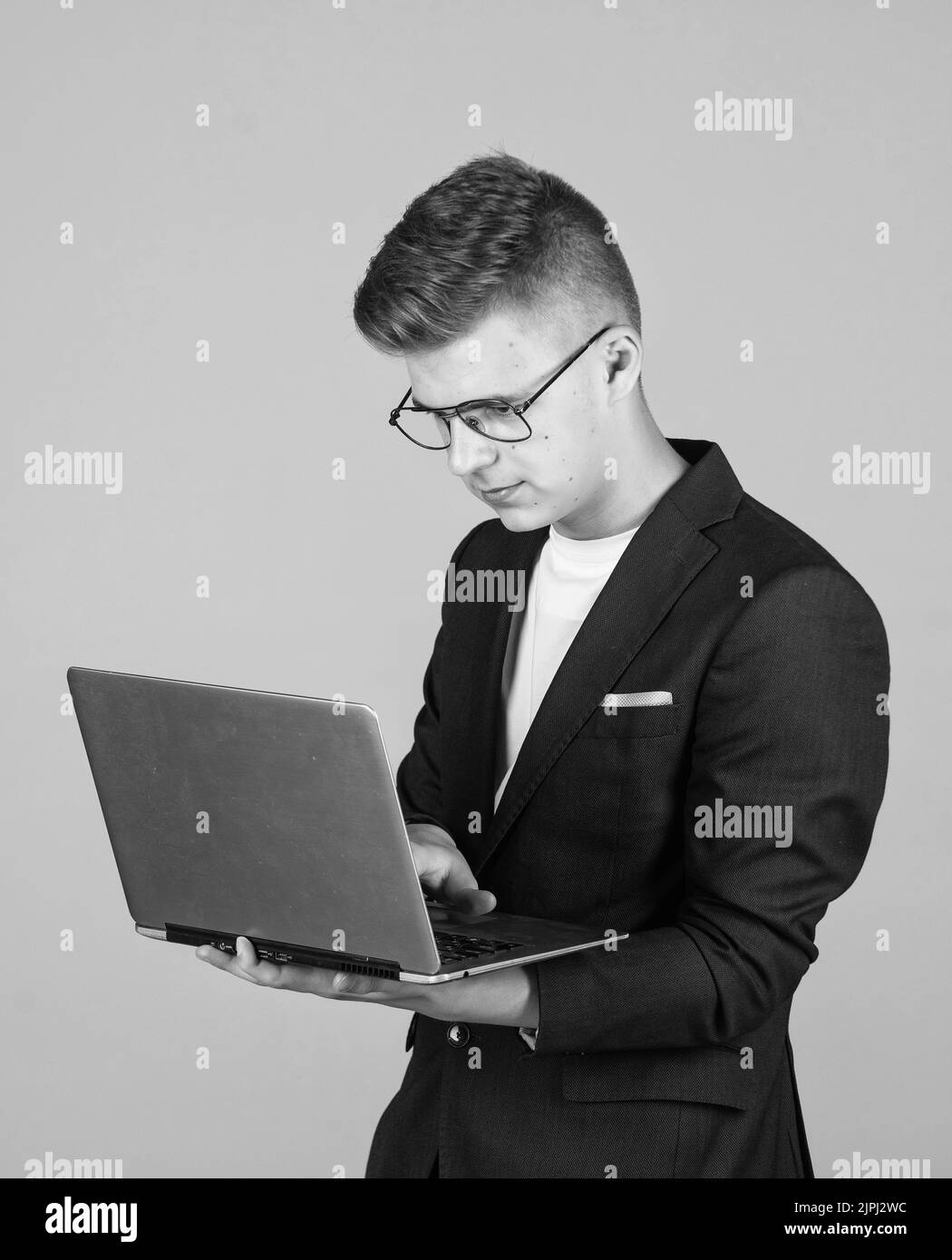 confident kid boy in glasses. shopping online. teen boy work on laptop ...